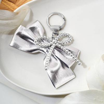 Buy Twinkle Tie Silver Bow Bag Charm in Accessories | Best Jewellery on ...